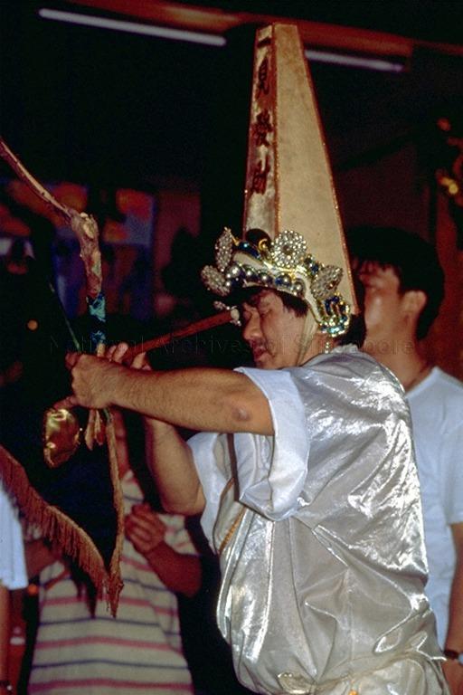 Medium (tangki) in a trance during ritual at Taoist temple