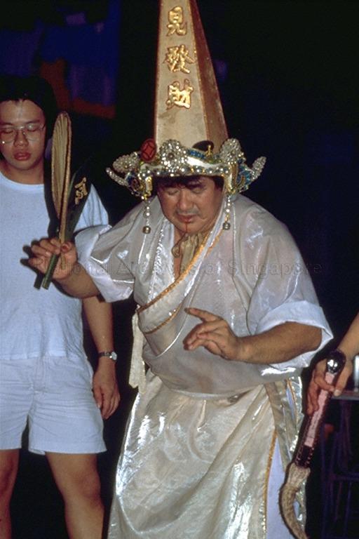 Medium (tangki) performing ritual at Taoist temple