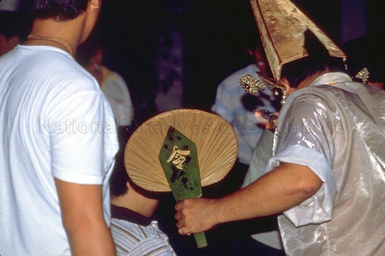 Medium (tangki) performing ritual at Taoist temple