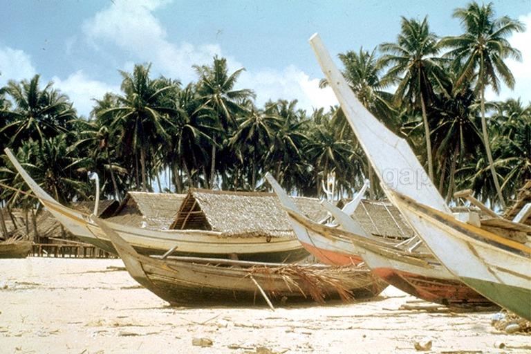 Fishing boats known as 'Perahu Payang' on the beach of Paka