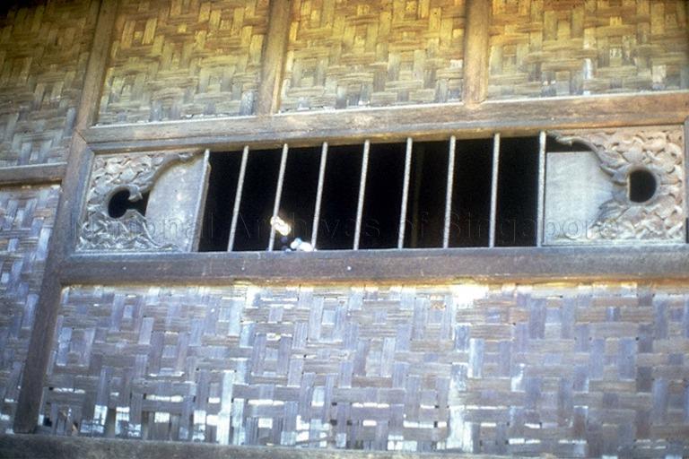 View of window details of a traditional attap house in