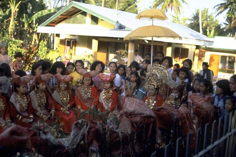 A Minangkabau wedding ceremony in progress. The bride