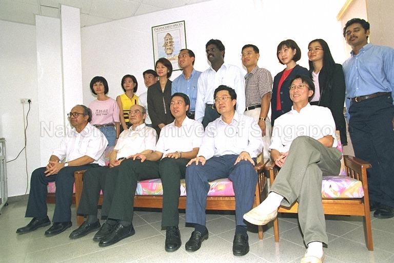 Group photo of residents taken with (seated row from left)