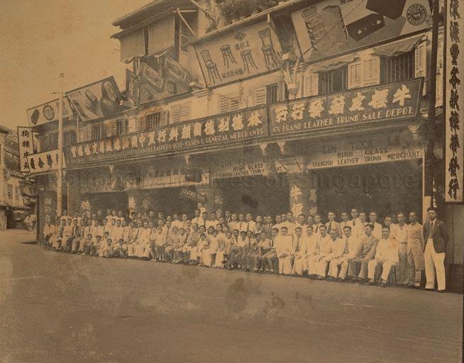 Middle-class Chinese posing in front of Lim Teck Lee High