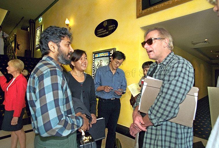 Australian director Peter Weir (right) talking to