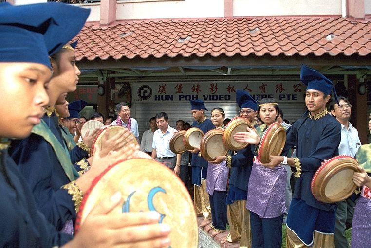 Malay cultural group playing the kompang to welcome Minister