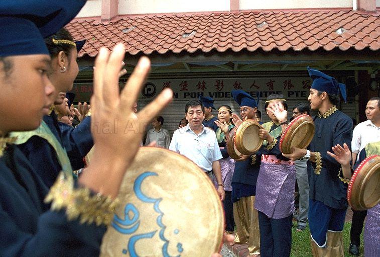 Malay cultural group playing the kompang to welcome Minister