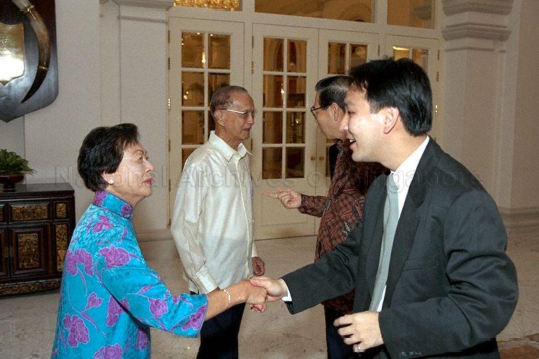 PRESIDENT ONG TENG CHEONG (2ND RIGHT) AND HIS SON, TZE BOON