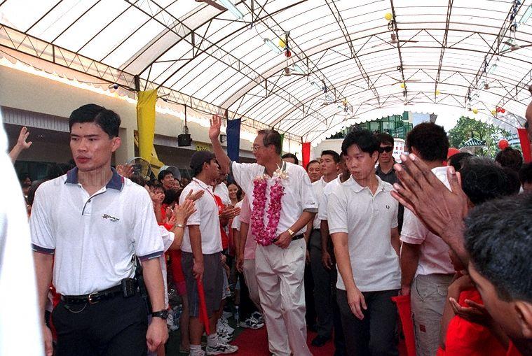 Prime Minister Goh Chok Tong (garlanded) arriving at Chong