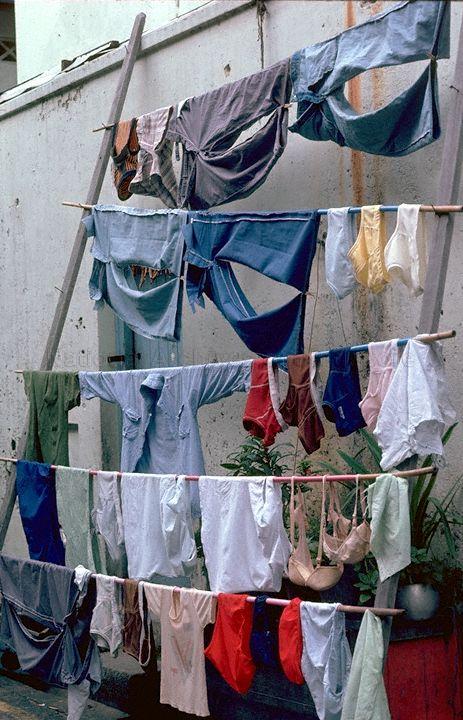 CLOTHES HANGING TO DRY ON BAMBOO POLES