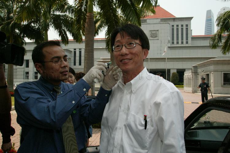 Minister for the Environment Lim Swee Say having his
