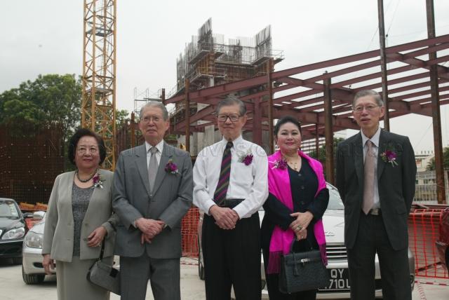 Posing for photograph during foundation stone laying