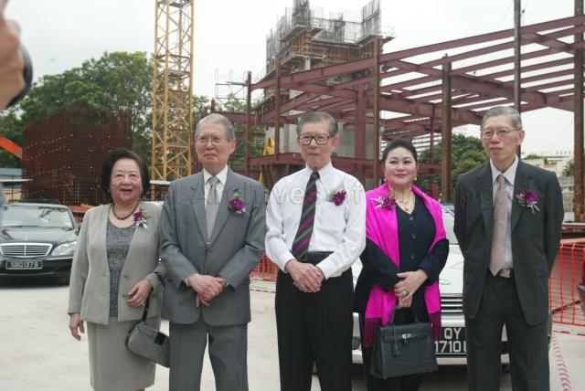 Posing for photograph during foundation stone laying
