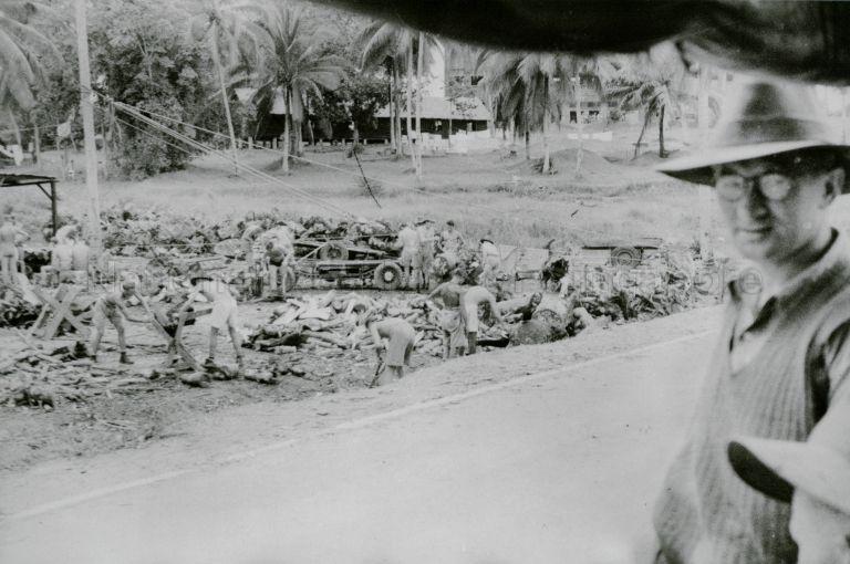 AN UNIDENTIFIED ALLIED PRISONER OF WAR (POW) LOOKS AT THE