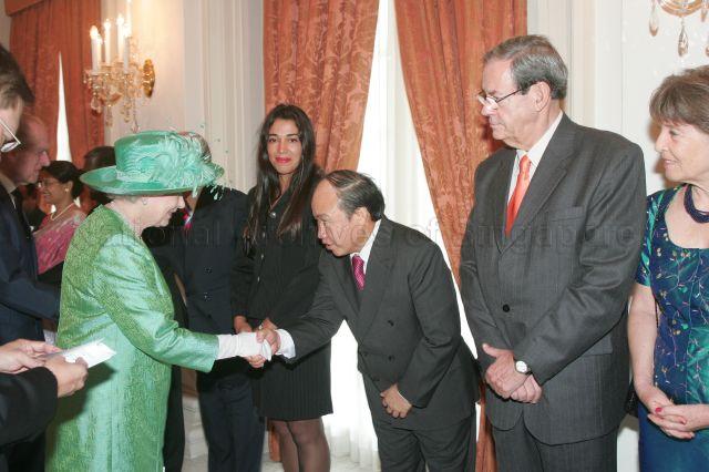 Queen Elizabeth II going through a receiving line of
