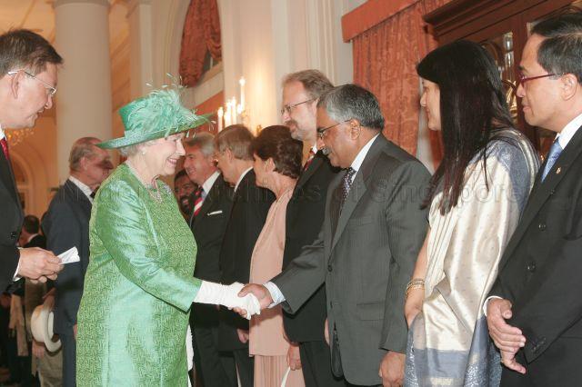 Queen Elizabeth II going through a receiving line of
