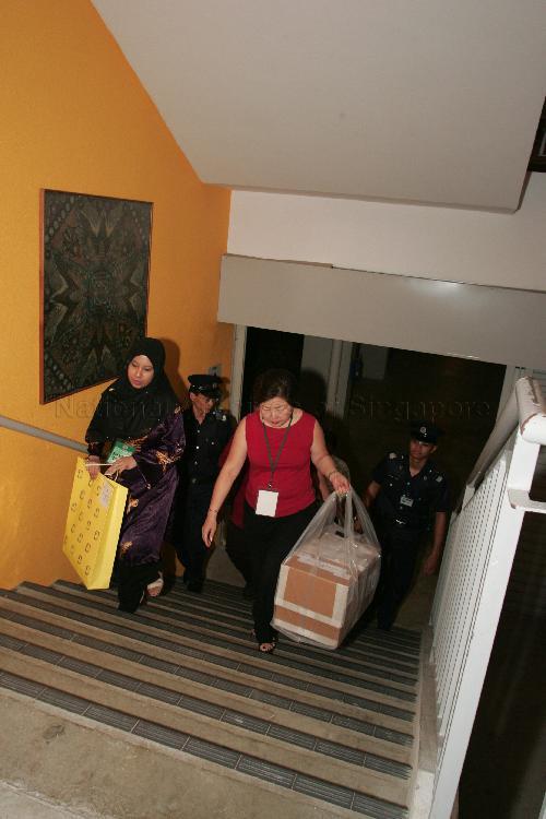 Presiding Officer delivering sealed ballot boxes to counting
