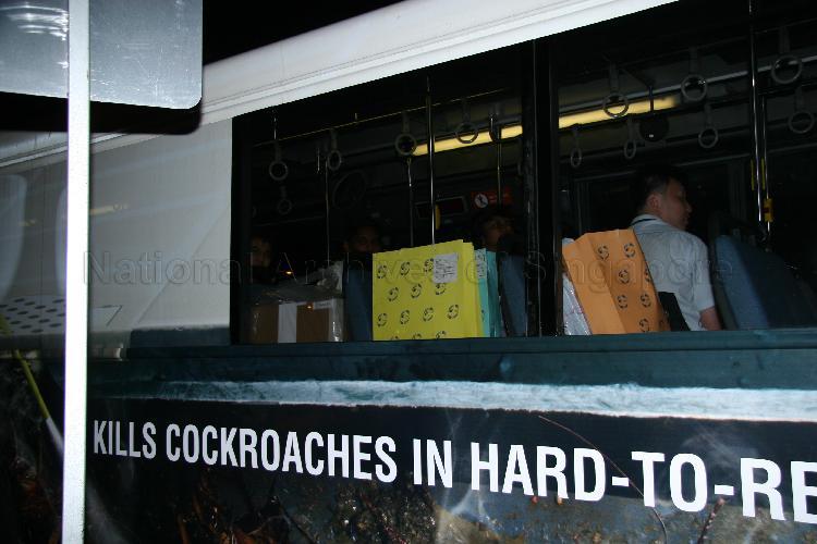 View of election officials and ballot boxes in the bus which