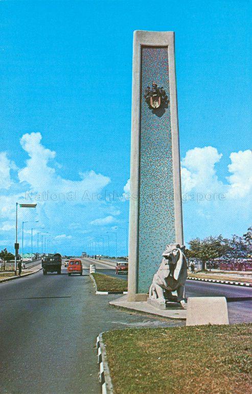 Monument and stone lion at each end of Merdeka Bridge, which