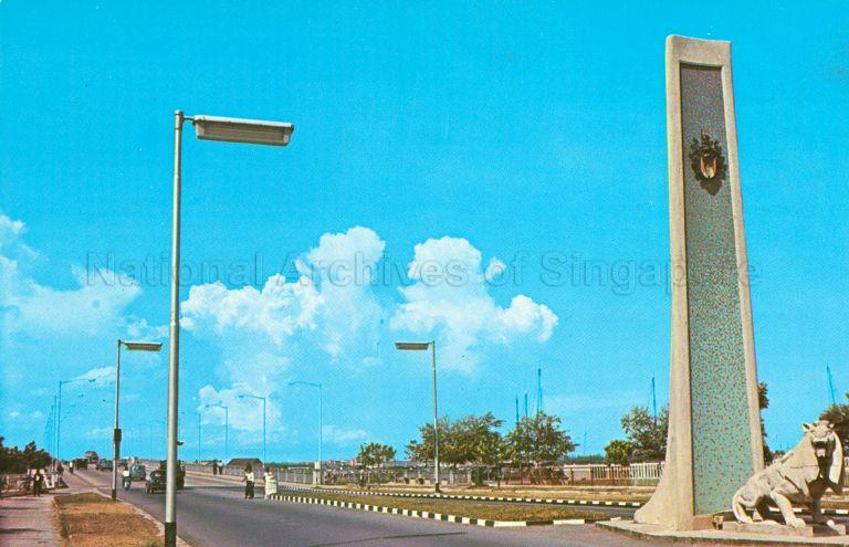 Monument and stone lion at each end of Merdeka Bridge, which