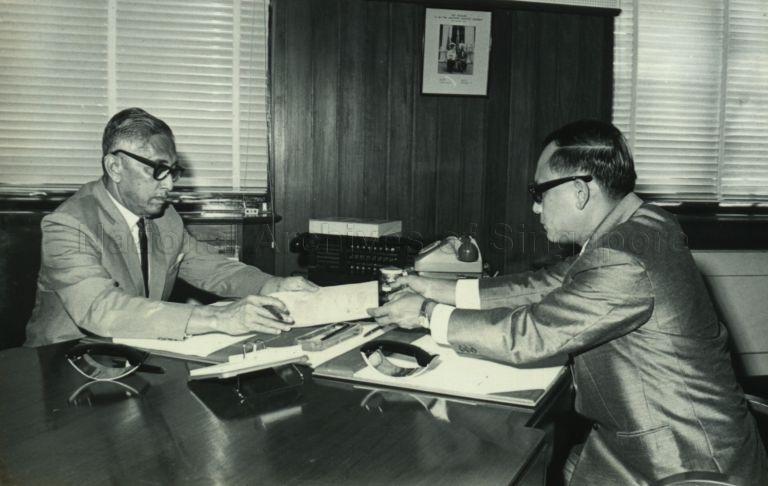 President Yusof Ishak presenting letter of appointment to