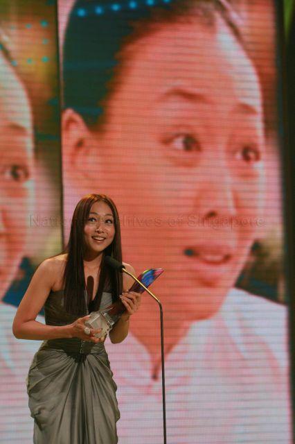 MediaCorp artiste Ng Hui delivering speech after receiving