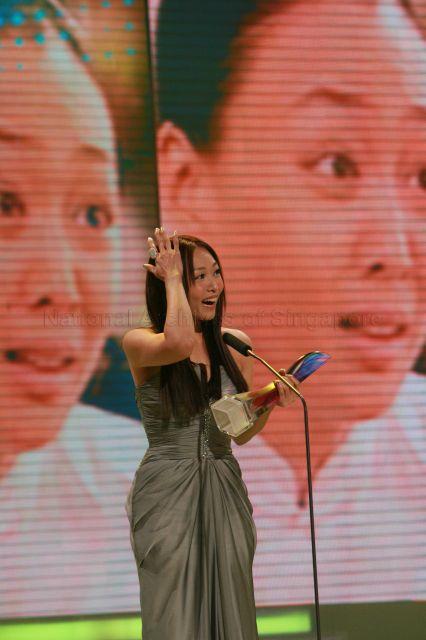 MediaCorp artiste Ng Hui delivering speech after receiving