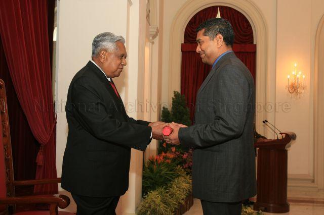 President S R Nathan presenting instrument of appointment to