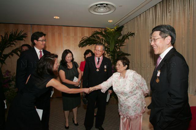 Mrs S R Nathan, wife of President, greeting family members