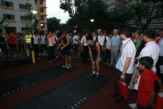 Minister Mentor Lee Kuan Yew watching standing broad jump