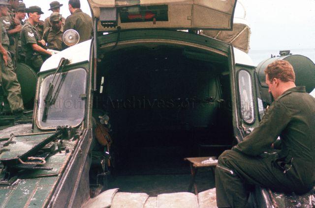 SOLDIERS FROM THE 18TH SIGNAL REGIMENT LOADING STORES ONTO