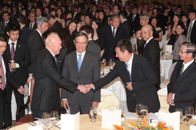 Minister Mentor Lee Kuan Yew being greeted at the VIP table