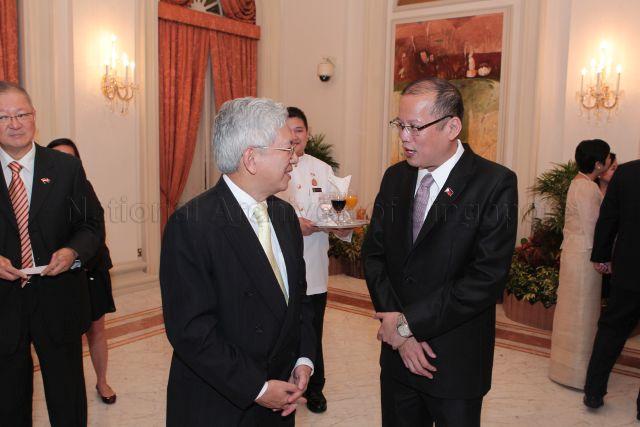 Philippine President Benigno S Aquino with guest at cocktail