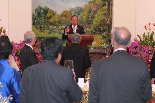 Philippine President Benigno S Aquino proposing a toast