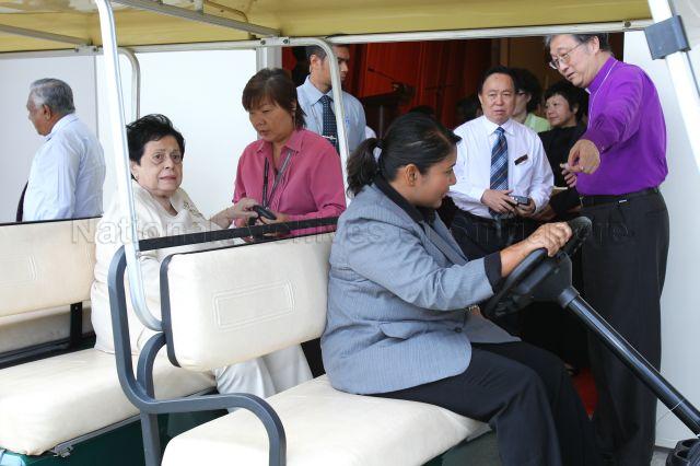Mrs S R Nathan, wife of the President, in a club car buggy