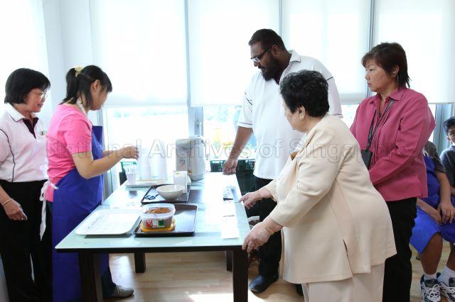 Mrs S R Nathan, wife of the President, observing a training