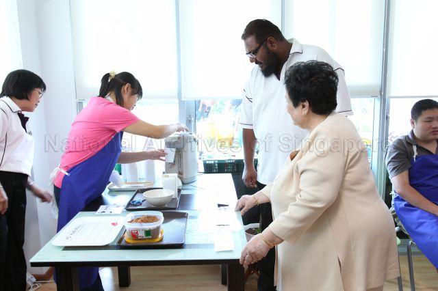 Mrs S R Nathan, wife of the President, observing a training