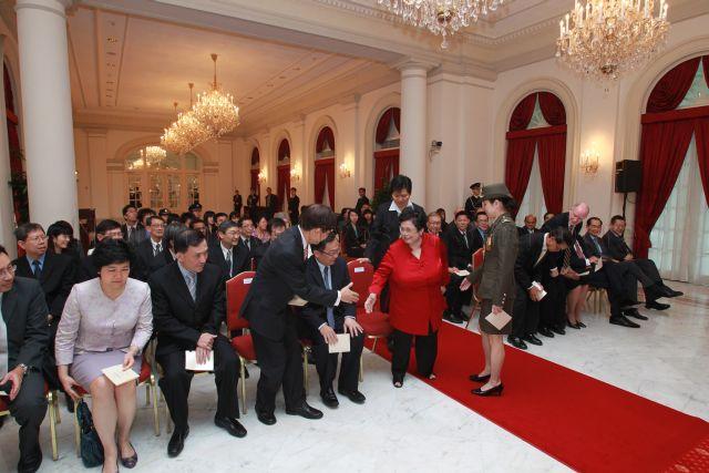 Mrs S R Nathan, wife of the President, being greeted by
