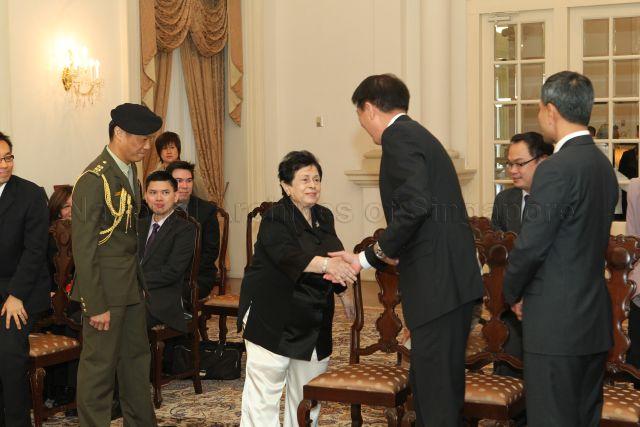Mrs S R Nathan, wife of the President, being greeted by