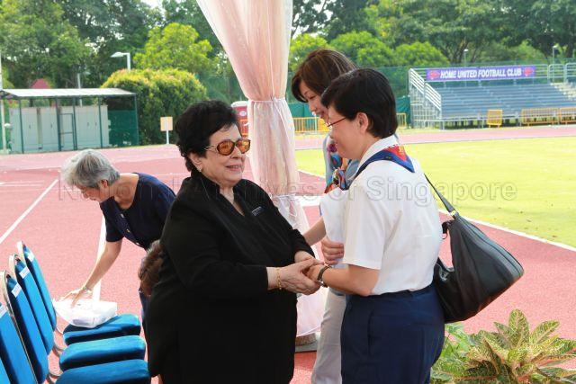 Mrs S R Nathan, wife of the President, shaking hands with