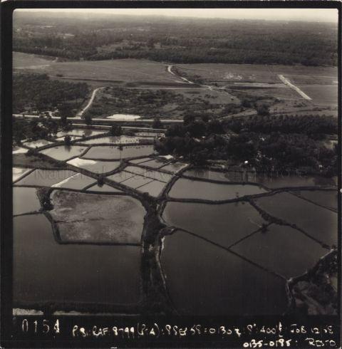 Aerial view of inundated farmland, likely to be in