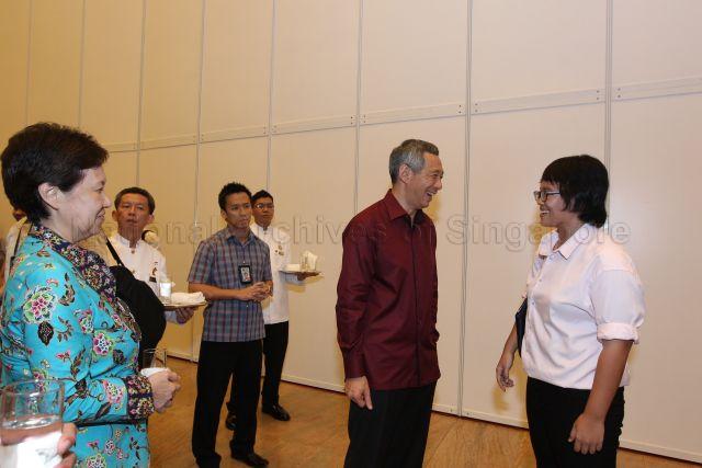 Prime Minister Lee Hsien Loong with Ms Tok Kheng Leng, a