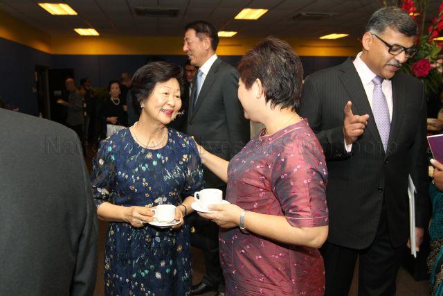 Mrs Mary Tan chatting with guests.