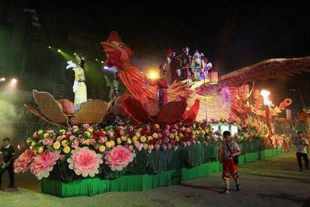 Performers on a vibrant float at Chingay parade 2013 held at