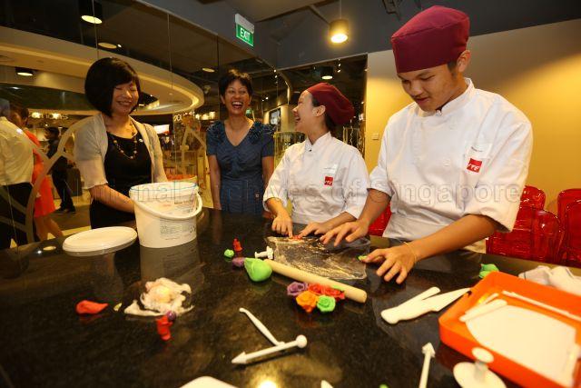 ITE students speaking with officials on the sidelines of