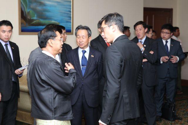Chief Minister of Yangon He U Myint Swe (left) chatting with