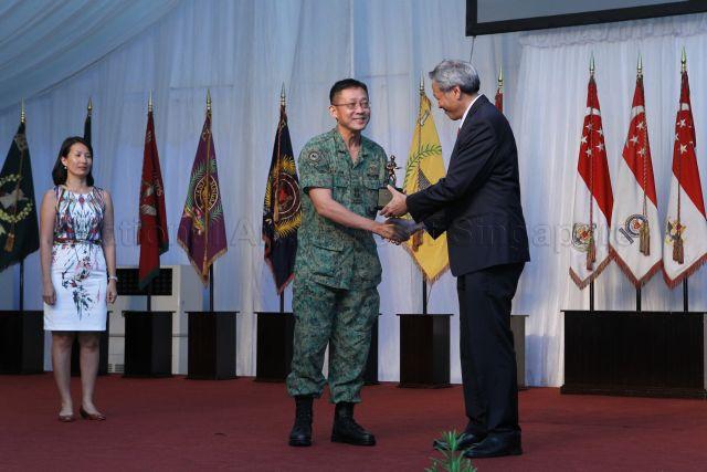 Minister for Defence Ng Eng Hen (right) presenting Singapore