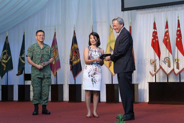 Minister for Defence Ng Eng Hen (right) presenting Singapore
