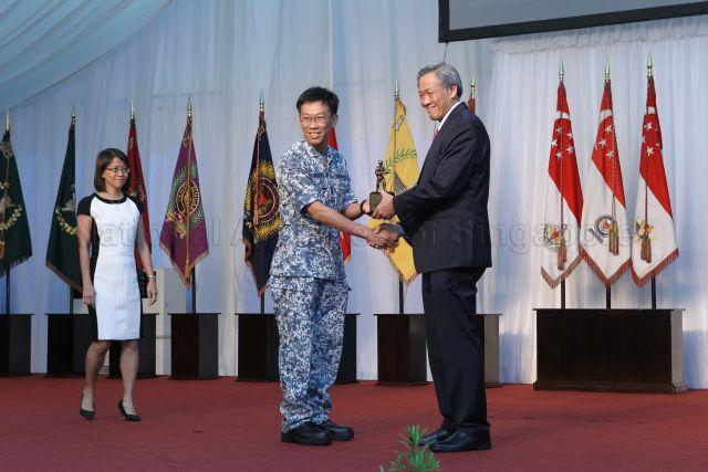 Minister for Defence Ng Eng Hen (right) presenting Singapore