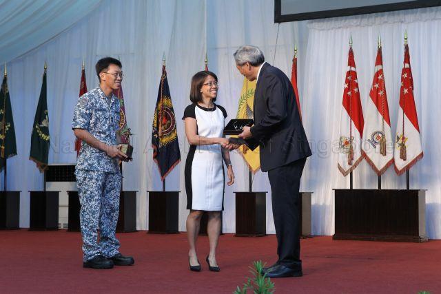 Minister for Defence Ng Eng Hen (right) presenting Singapore